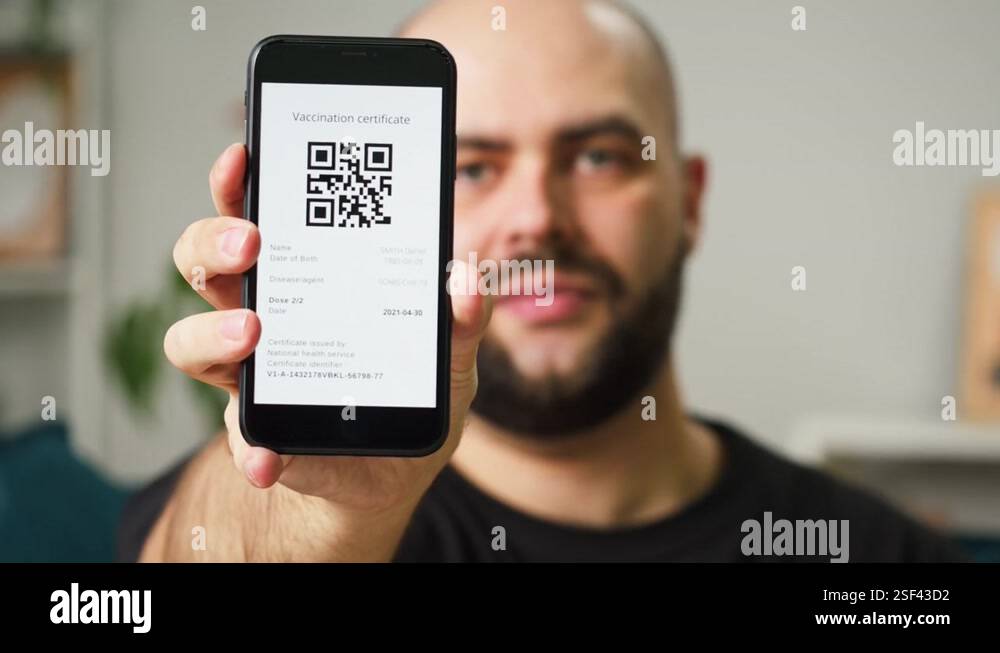 man show on phone vaccination passport with qr code, international ...
