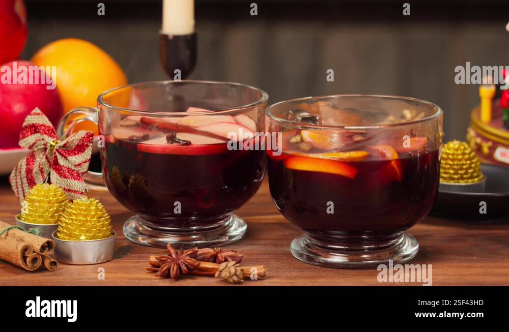 Mulled wine in glasses, gluhwein close-up. Hot red wine with apples ...
