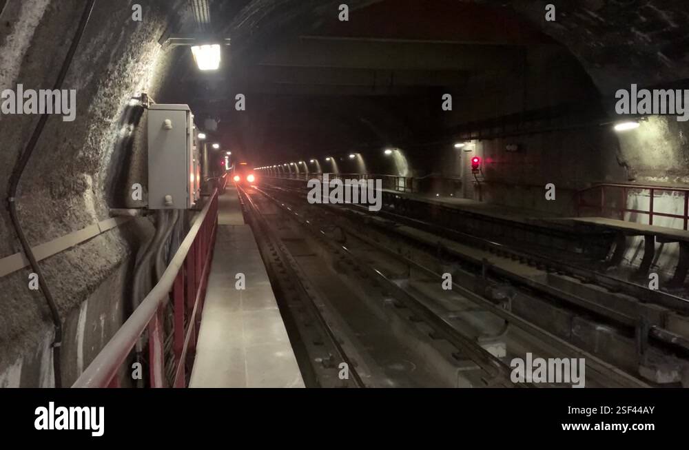 A subway or metro train in the underground tube on the electric rail ...