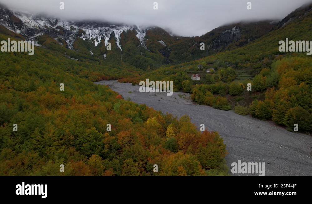 Valley of Valbona in Albania, Alpine village near riverbed with ...