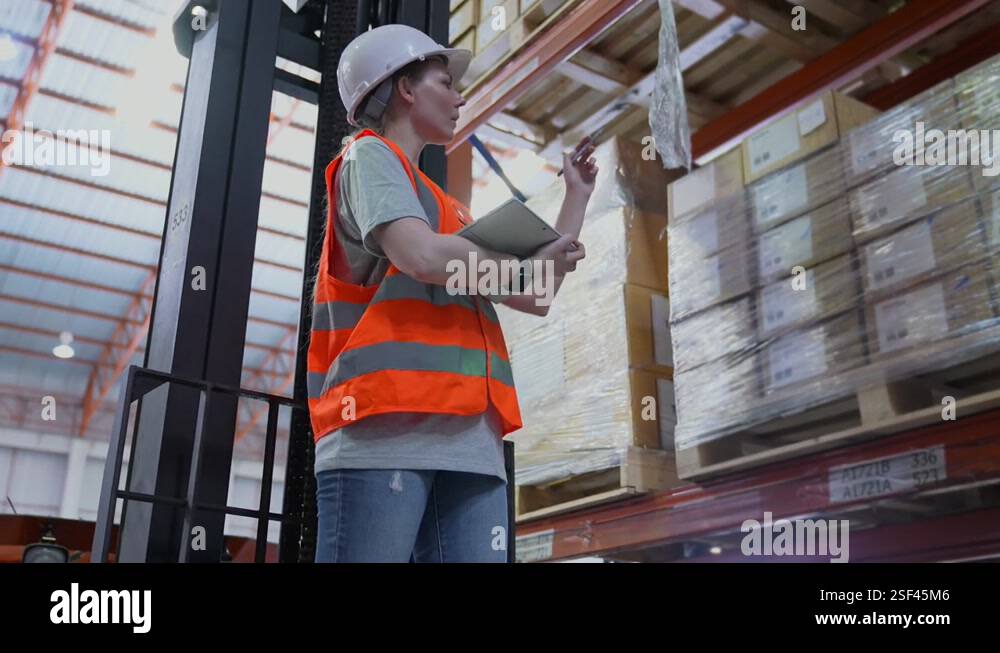 Business concept of 4k Resolution. An employee is checking the goods ...