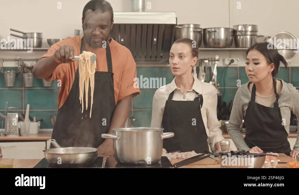 Diverse People Cooking Pasta Stock Video Footage - Alamy