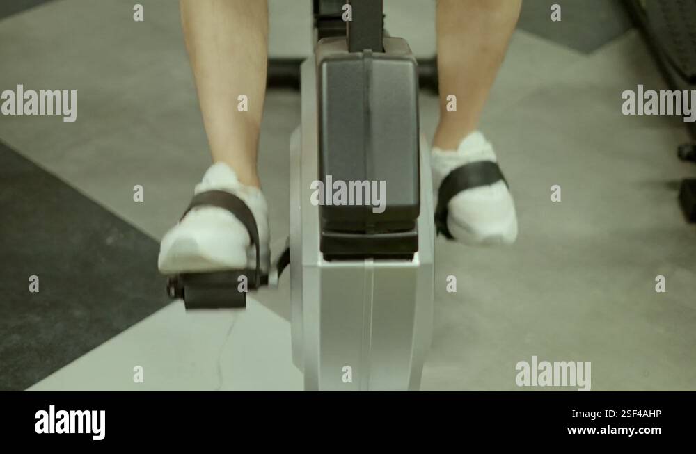 Close-up feet of a man walking on a walking machine in a gym Stock ...