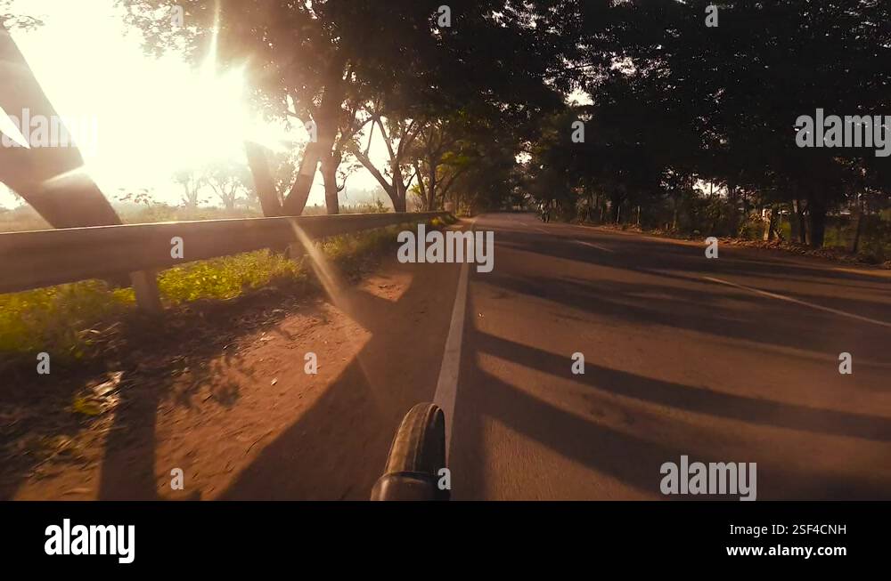 POV Bicycle Pedaling Along The Layby Divider On a Highway In The ...