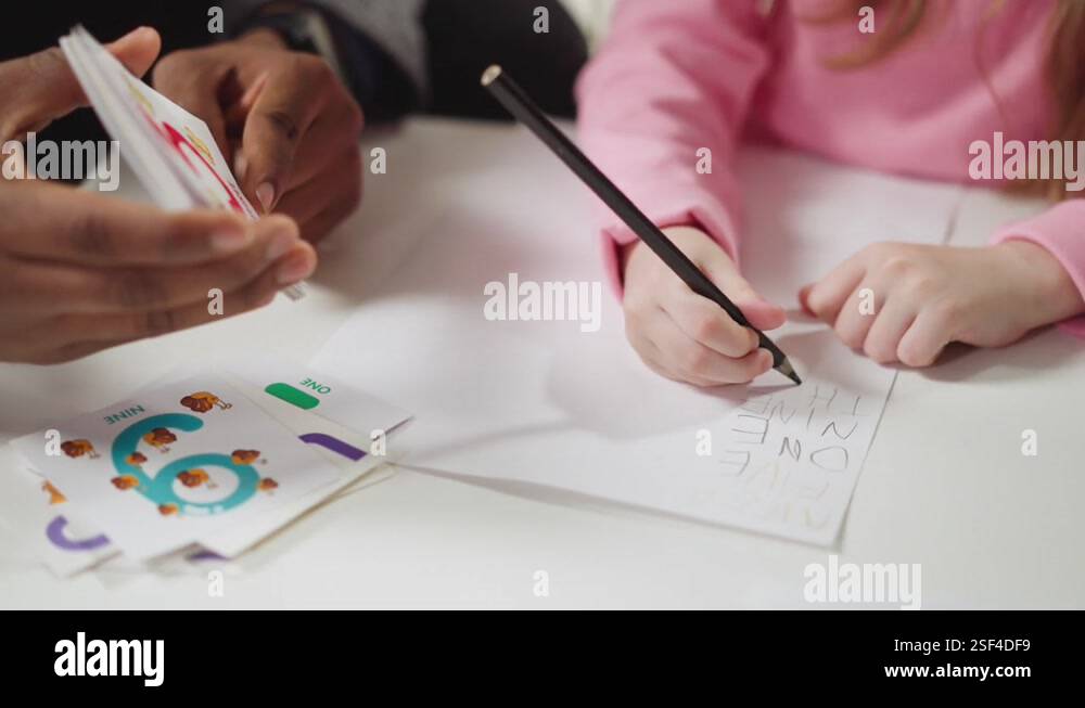 English teacher holds card schoolgirl writes digit name Stock Video ...