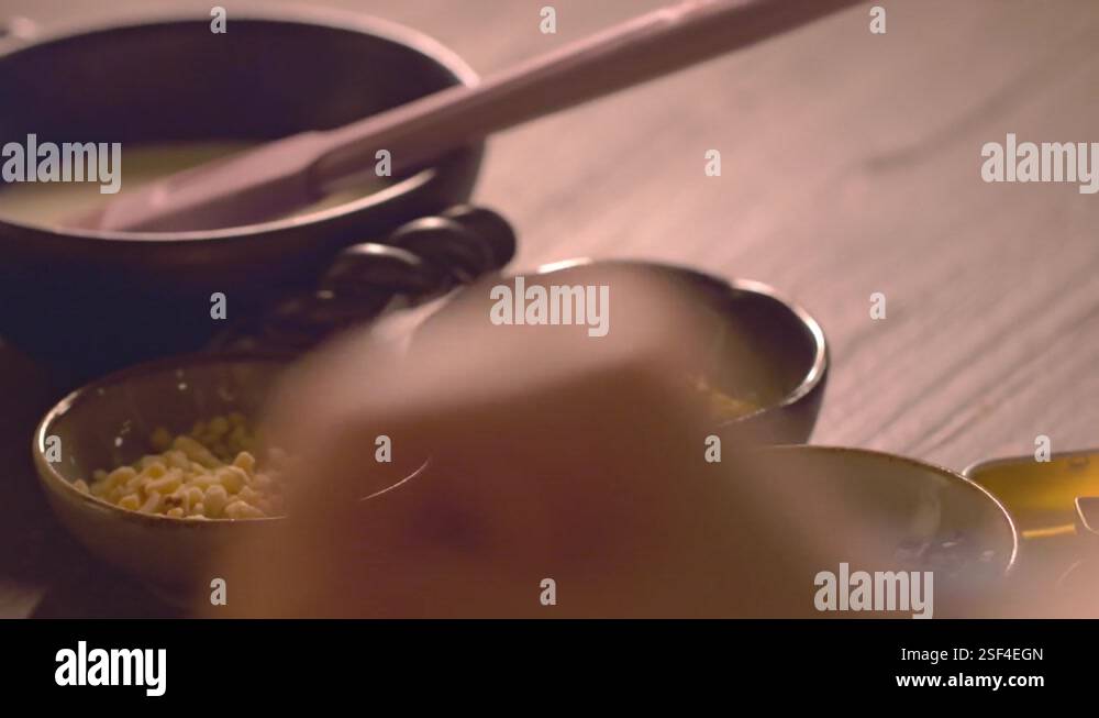 Female Child hands grabbing chopped up ingredients from bowls on ...