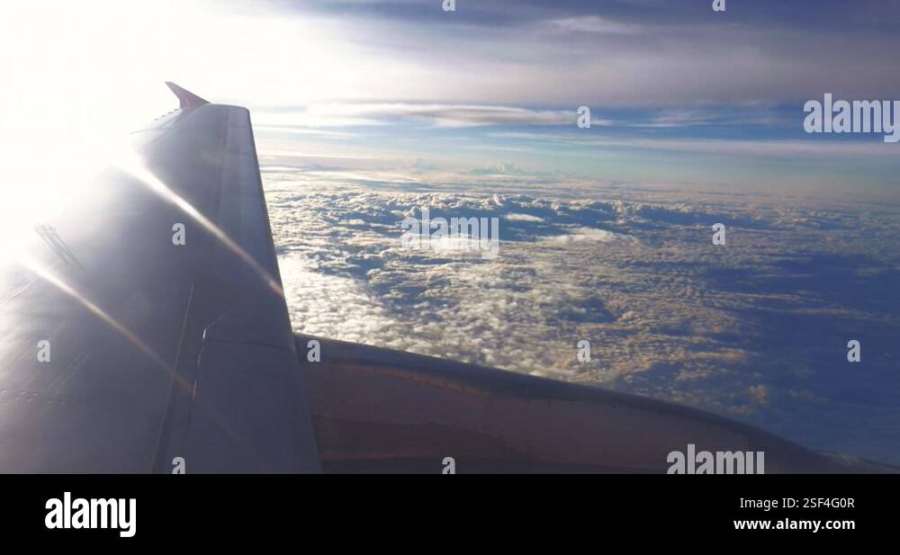 Airplane flies fast through cloud layers Stock Video Footage - Alamy