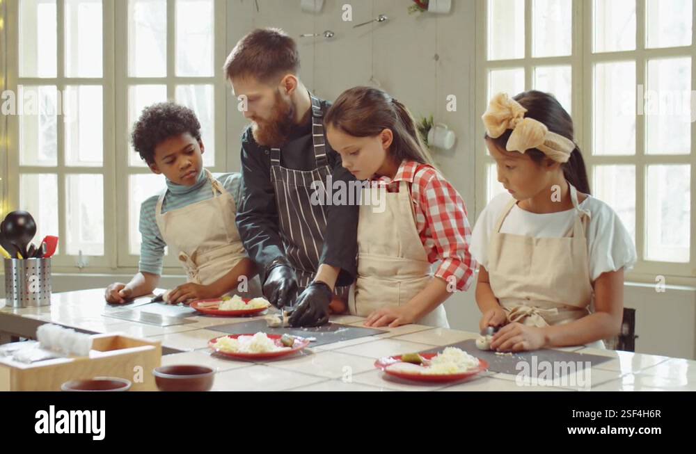 Chef Teaching Kids Cooking on Culinary Masterclass Stock Video Footage ...