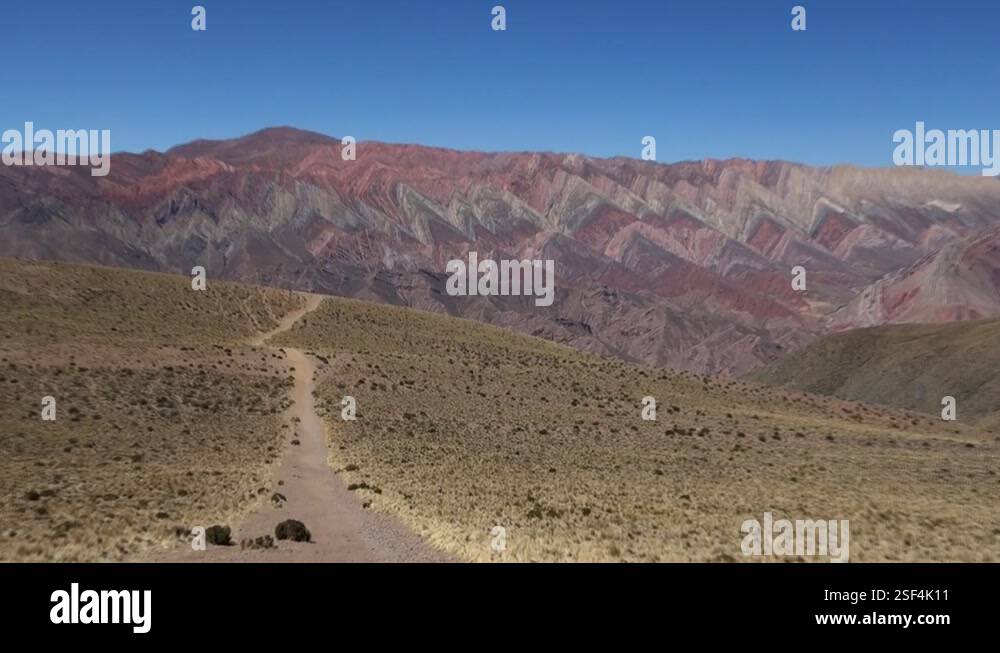 zooming in at colored mountains Hornocal, or Fourteen colors hill, city ...