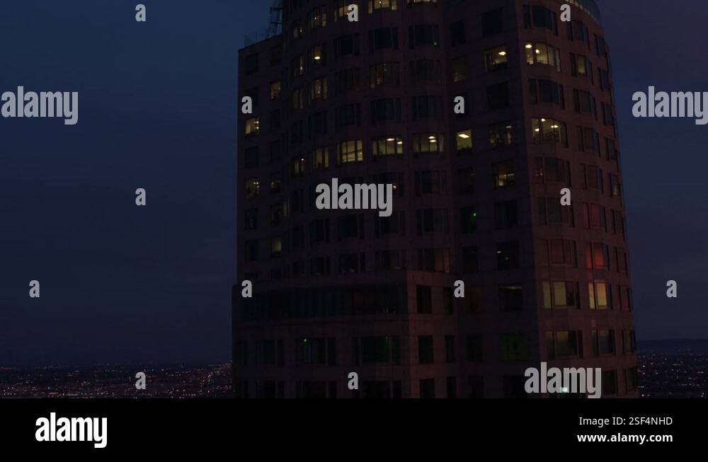 Aerial Ascending The Side Of Gleaming Highrise Building In Downtown La ...
