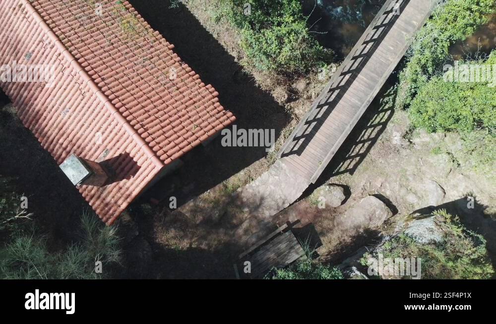 Bird's Eye View Of Tiled Roof House, Wooden Bridge And River In The ...
