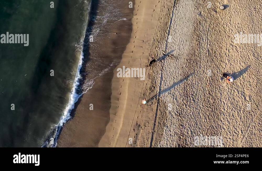 Bird eye aerial drone view of tourists and locals being next to the ...