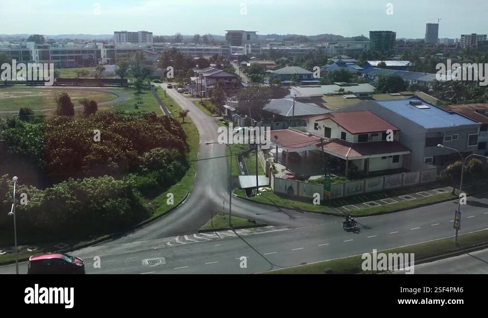Panning street view seen from the Golden Bay hotel window with sparse ...
