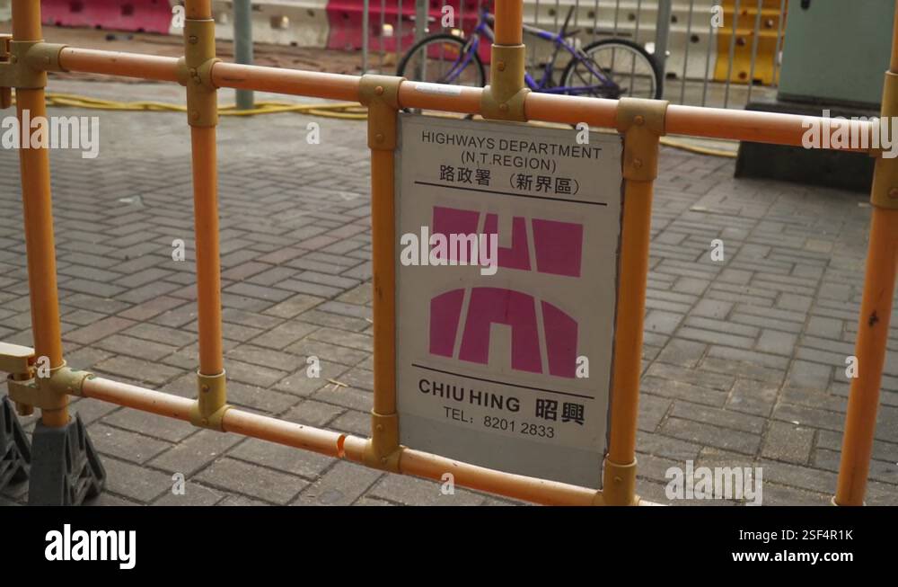 Sing on a road construction site. Highways Department in Hong Kong ...