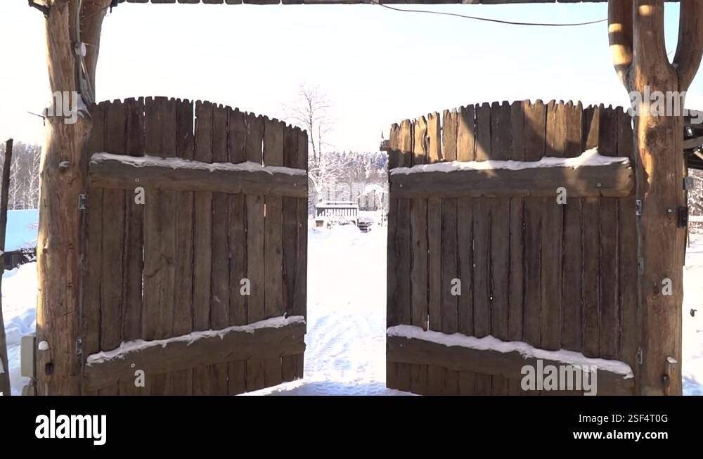 snow-covered wooden gates automatic openers for wooden gates in a ...