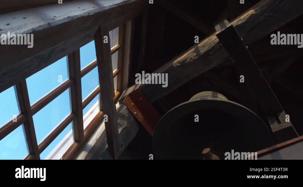 Looking up into old church bell tower point of view shot blue sky ...