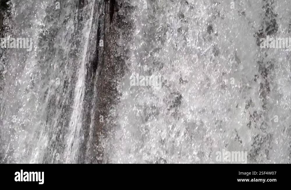 Slow motion of water release flowing, water overflows, excess capacity ...