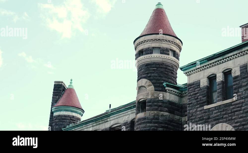 Castle or prison built from brick and limestone with a blue sky with Stock Video Footage - Alamy