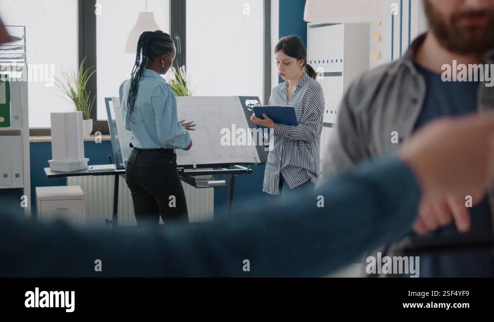 Man and woman doing teamwork to plan construction layout with digital ...