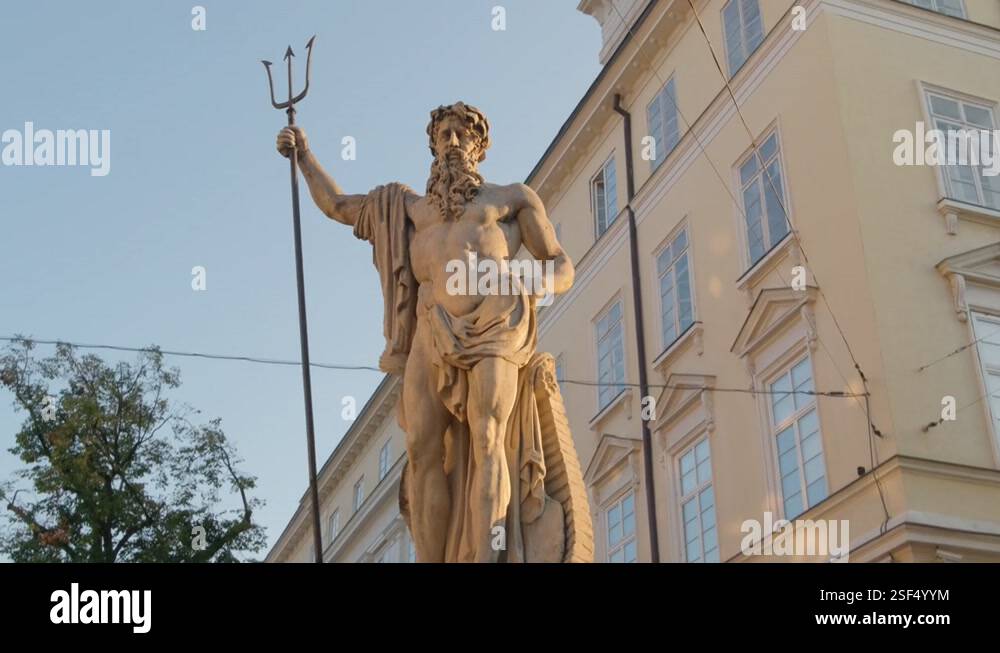 Neptune statue with town hall at background on Market square in Lviv ...