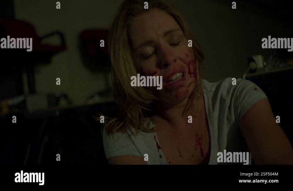 Terrified and blood covered woman in scary basement Stock Video Footage ...