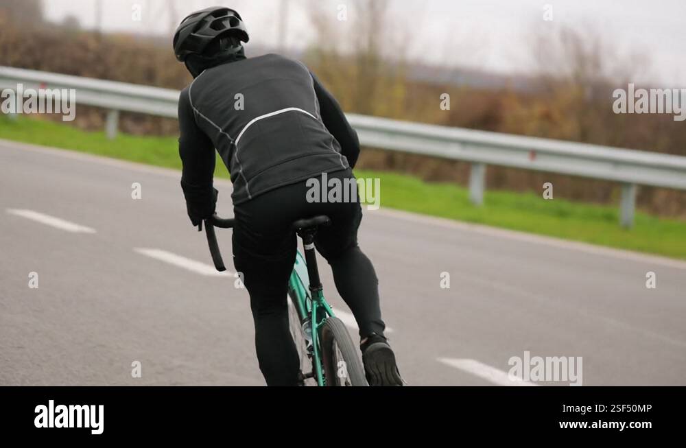 The athlete is riding a bicycle on the track. He is entering the turn ...