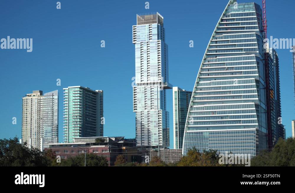 Zoom in shot of luxury high-rise apartment and new google building ...