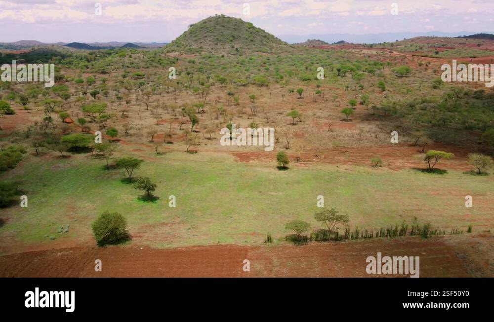 Border of plowed farmland and wilderness of African savanna in Southern ...