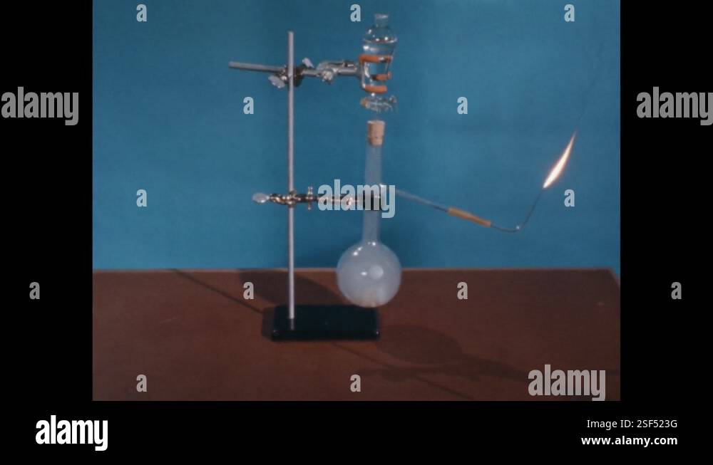 1960s: A cloudy gas in a distilling flask with a pipette on the side ...