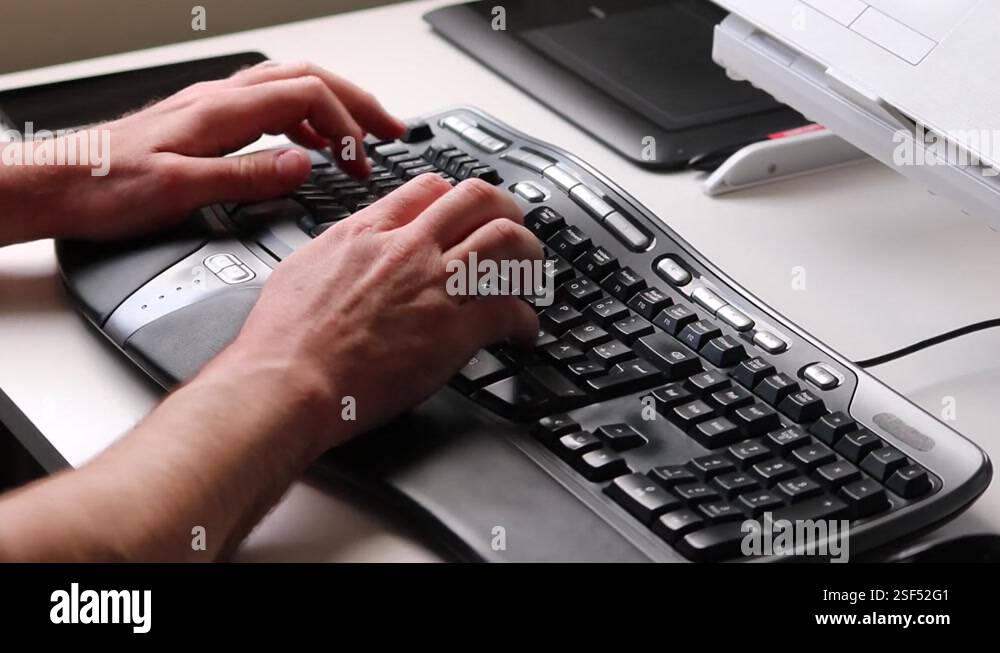 European man typing on keyboard an email at home Stock Video Footage ...