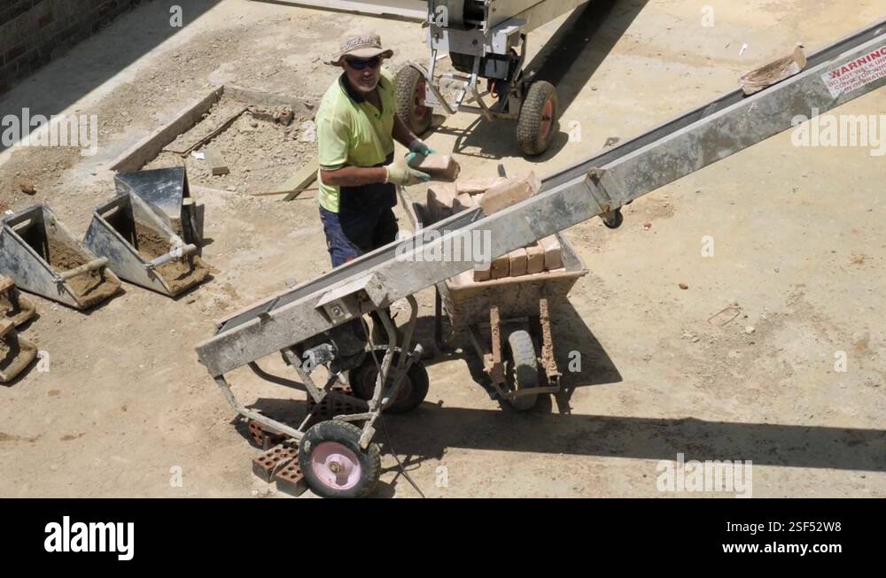 Bricklayer Places Bricks On Conveyor Belt Elevator, SLOW MOTION Stock ...