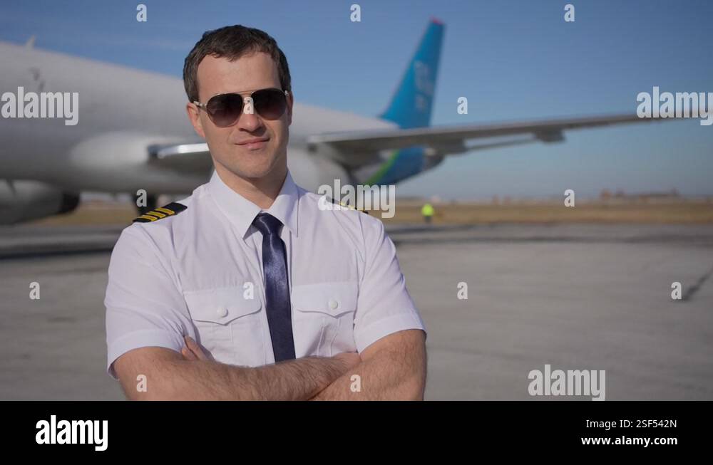 Airport, pilot, airplane. Portrait of confident male pilot wearing ...