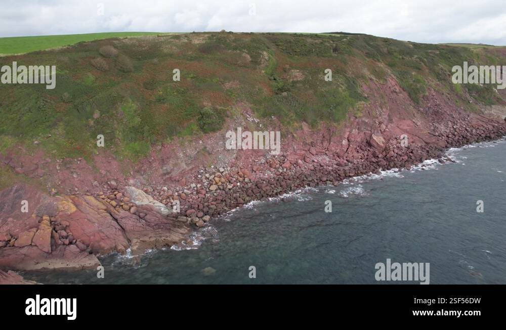 Sea coast, water washing big stone under steep slope Stock Video ...