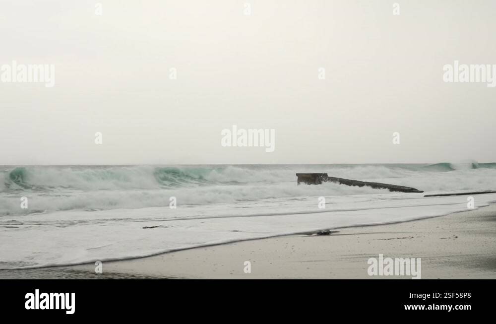 Dramatic stormy sea. Huge waves crash on shoreline creating an ...