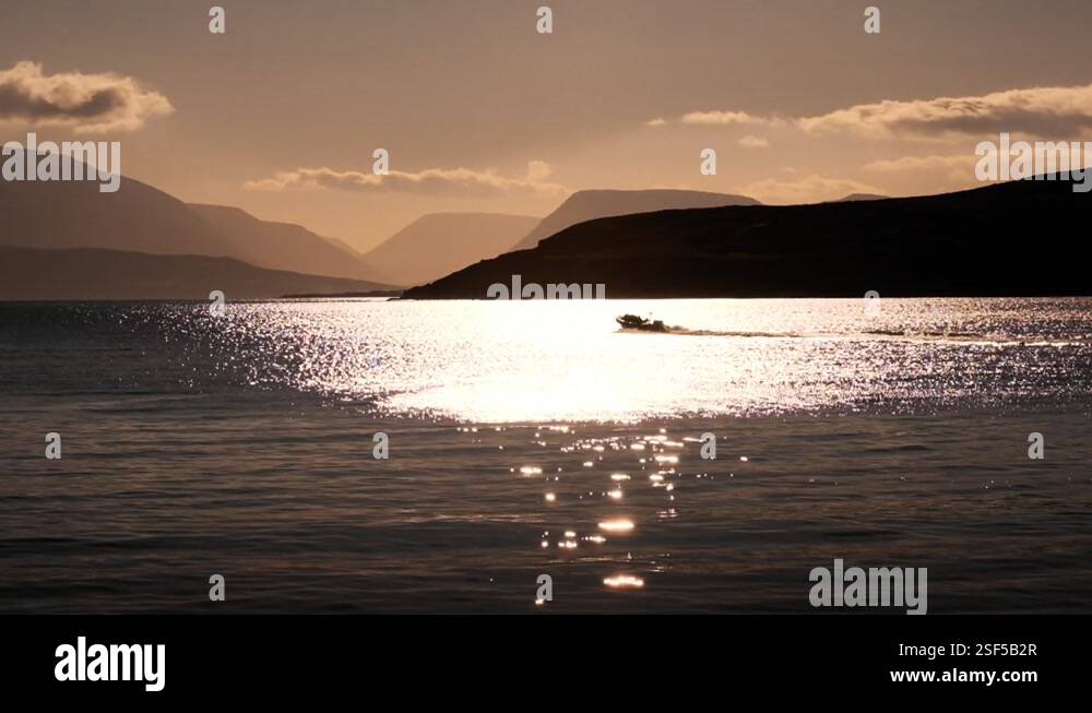 Sunset On Dalvik As A Tourist Boat Sails Out To Spot Whales Stock Video ...