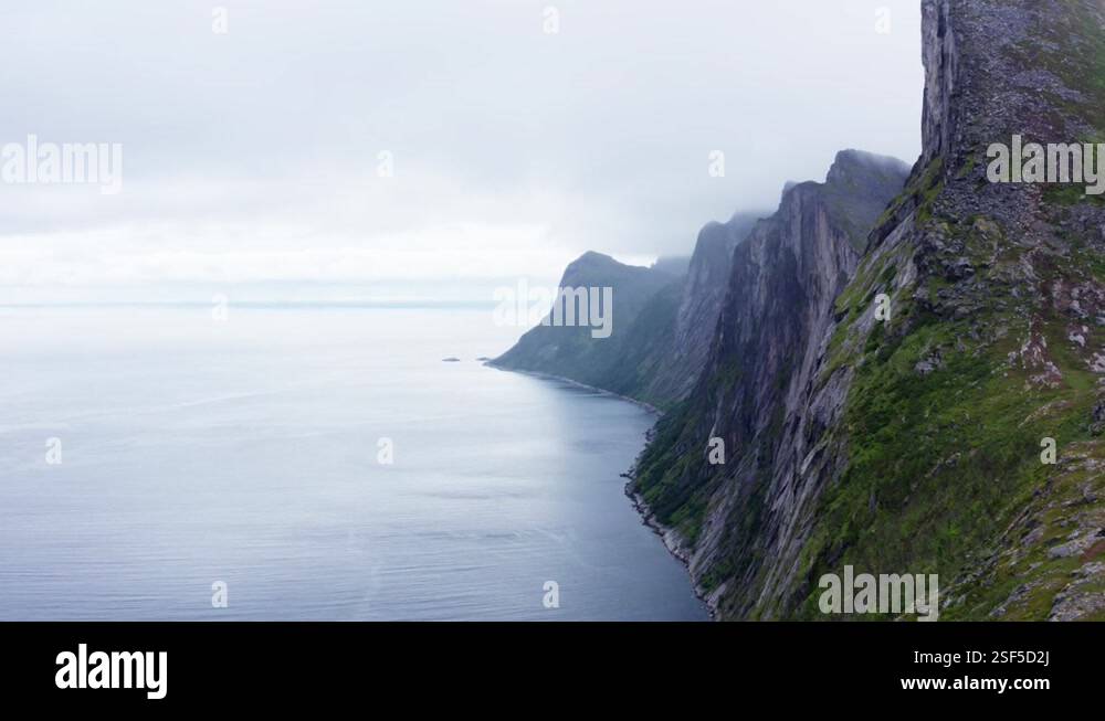 Towering Rocky Mountains Of Segla On Seafront In Senja Island, Norway ...