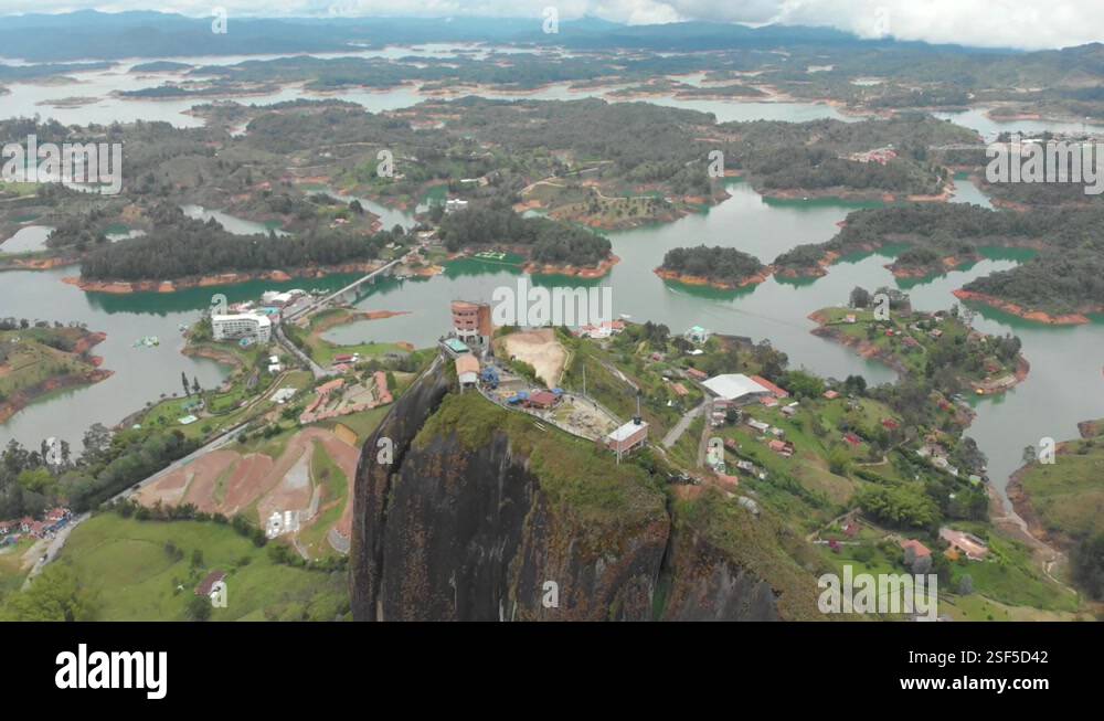 Aerial view of the Piedra del Penol rock in Guatape, Colombia during ...