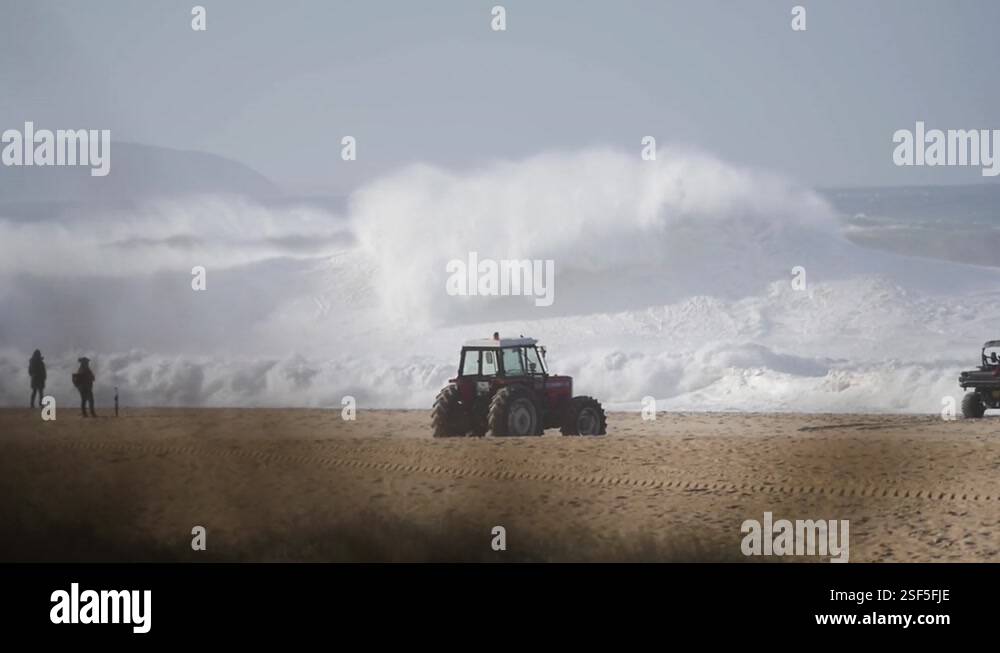 Slow motion of a wave break on the beach in Nazaré, Portugal. Nazaré is ...
