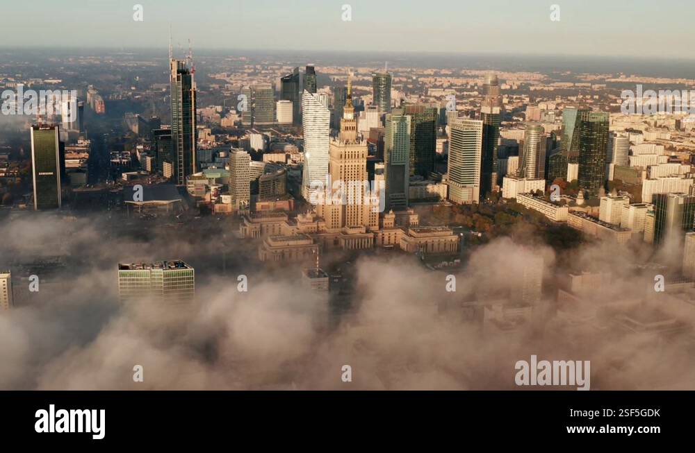Aerial panoramic footage of downtown high rise buildings in morning sun ...