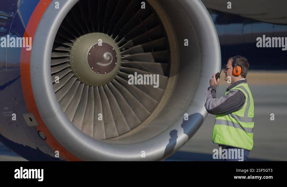 Airport. Aircraft engineer worker mechanic controlling work airdrome ...