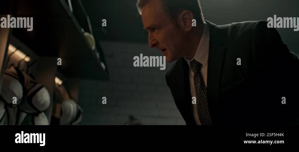 Angry disappointed coach talking to ice hockey team player on the ...