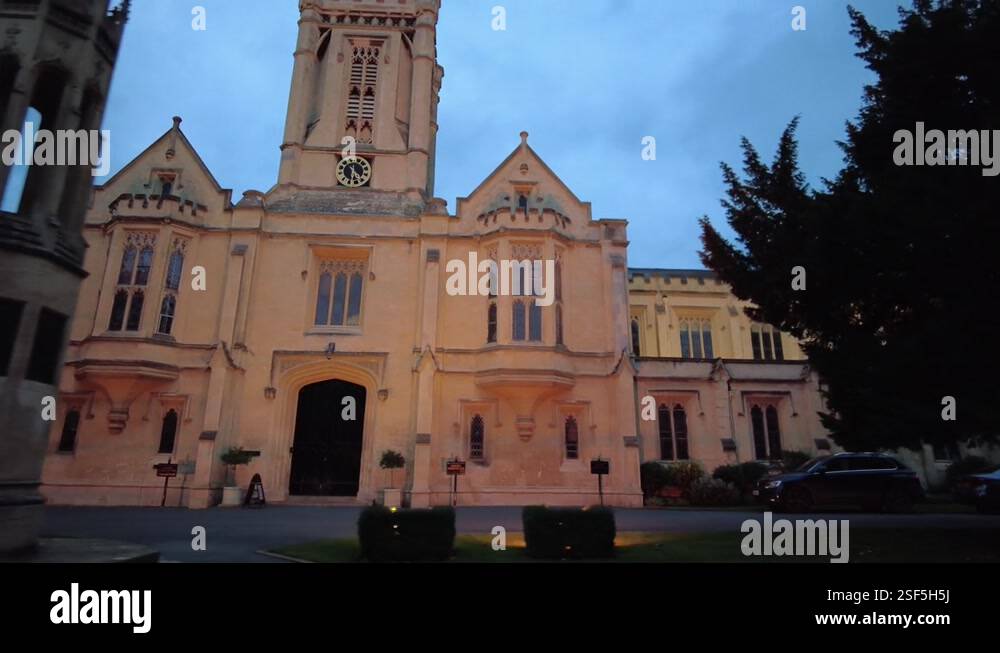 A beautiful old university building at dusk in Gloucestershire UK Stock ...