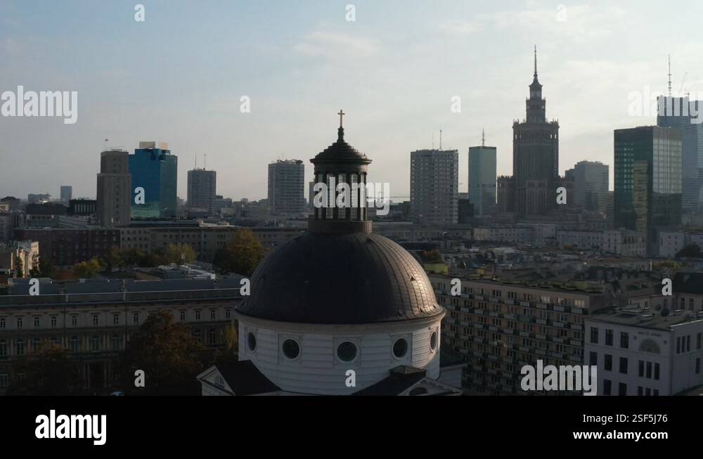Panorama curve shot of Holy Trinity Church and high rise buildings in ...