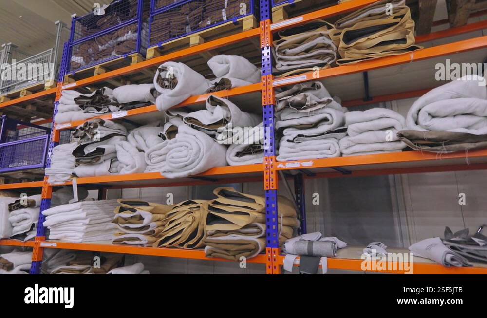 Textile warehouse at a garment factory. Warehouse of fabric at a ...