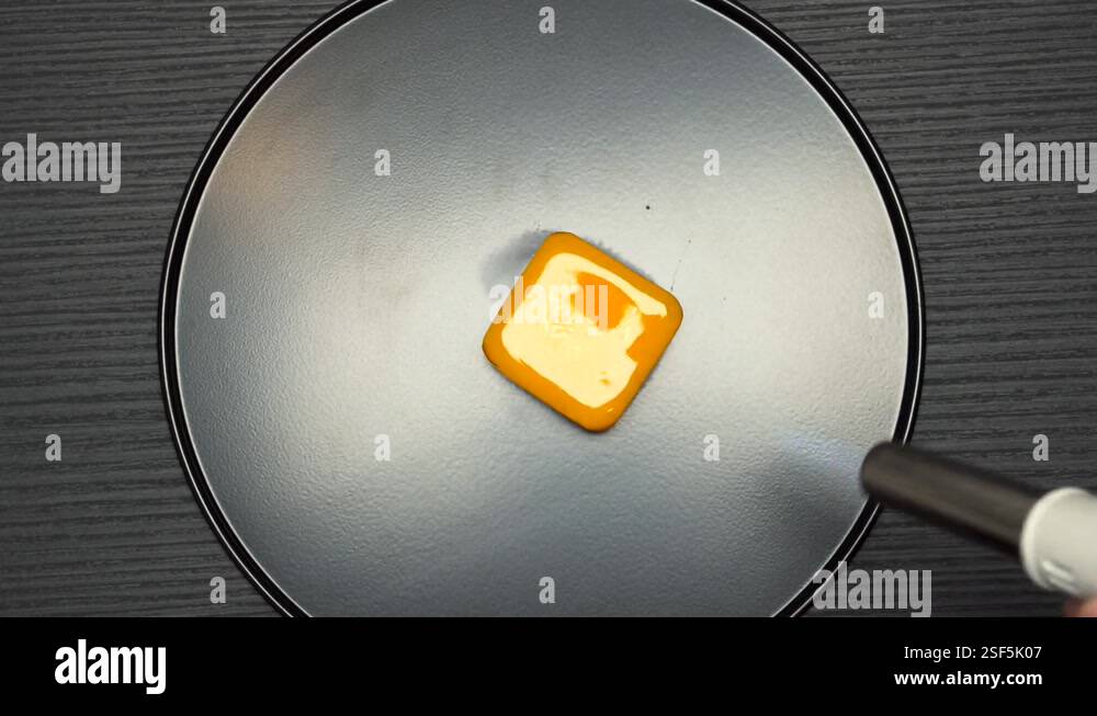 Melting a golden ice cube with a gas burner with DogeCoin inside ...