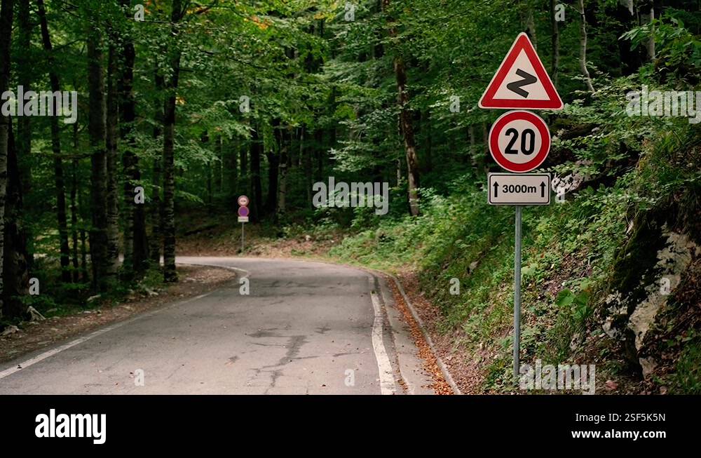 Road sign. A road sign warning about a sharp turn Stock Video Footage ...