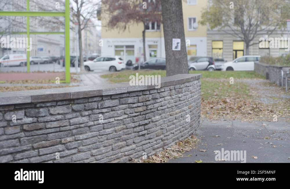 Handheld shot of male jumping over wall with parkour move in 4k Stock ...