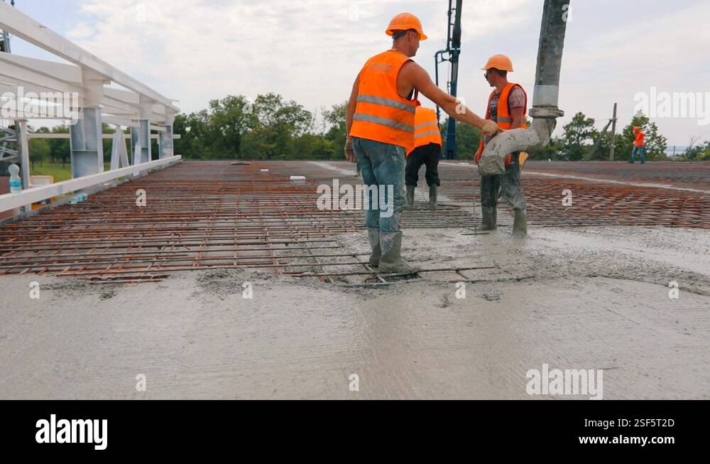 Reinforced concrete. Workers make a reinforced concrete structure ...