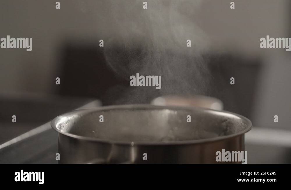 Slow motion water boiling in saucepan on induction stove Stock Video ...