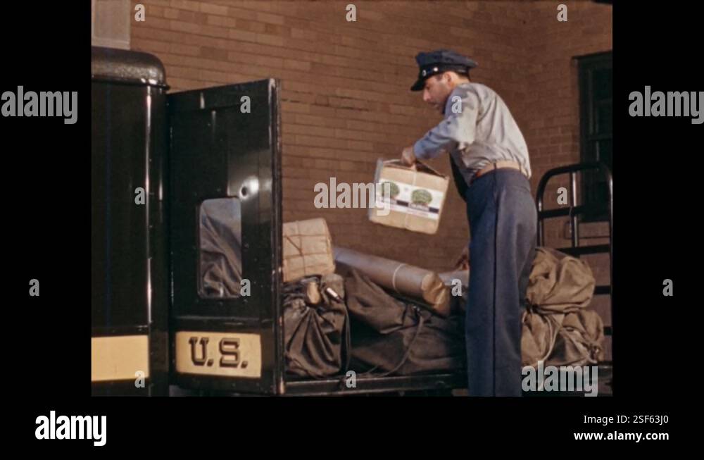 1960s: Man loads bags of mail onto back of truck. Mail carrier delivers ...